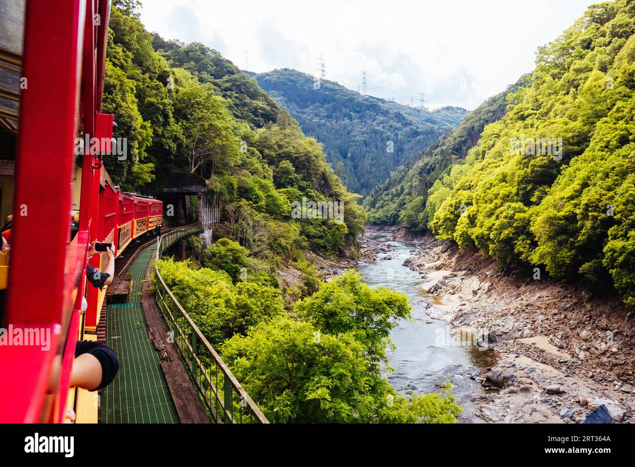 The world famous Sagano Romantic Train running along the Katsura River ...