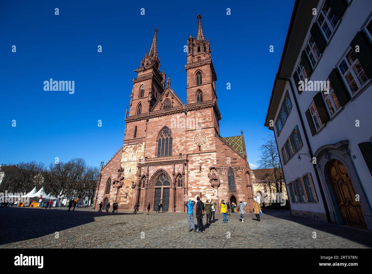 Basel, Switzerland, March 10, 2019: Basel Minster with people in front ...
