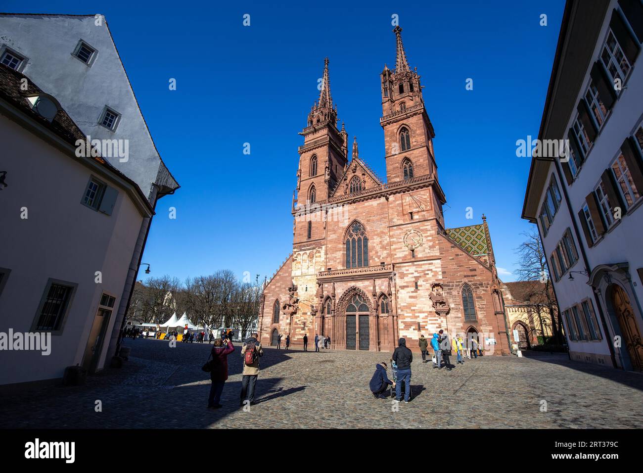 Basel, Switzerland, March 10, 2019: Basel Minster with people in front ...
