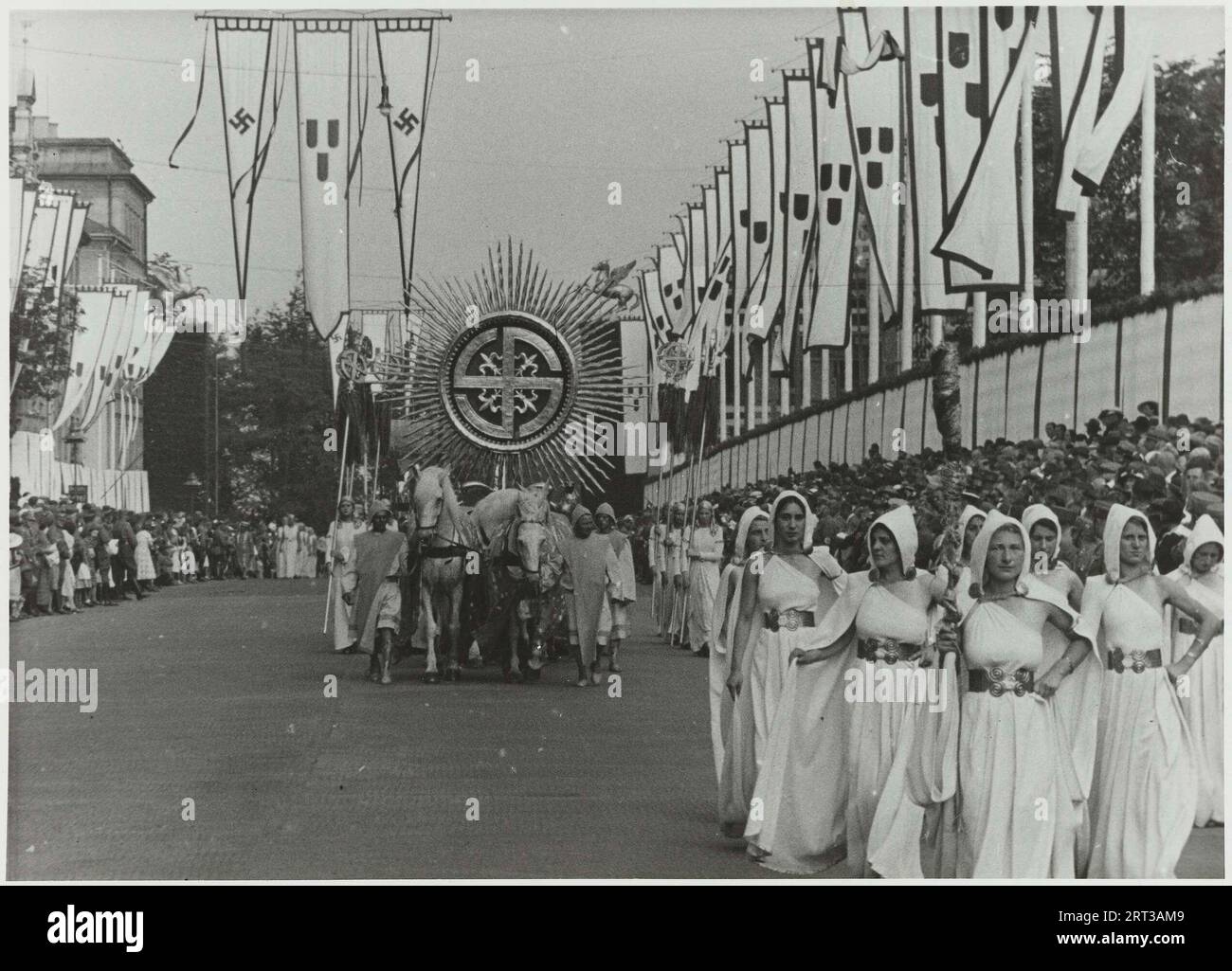 Parade in Berlin with women walking with flags with symbols and the ...