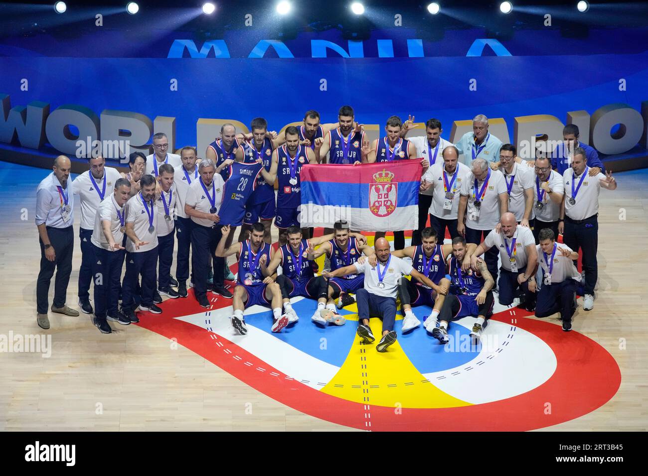 Serbia poses for a photo after losing to Germany in the championship ...