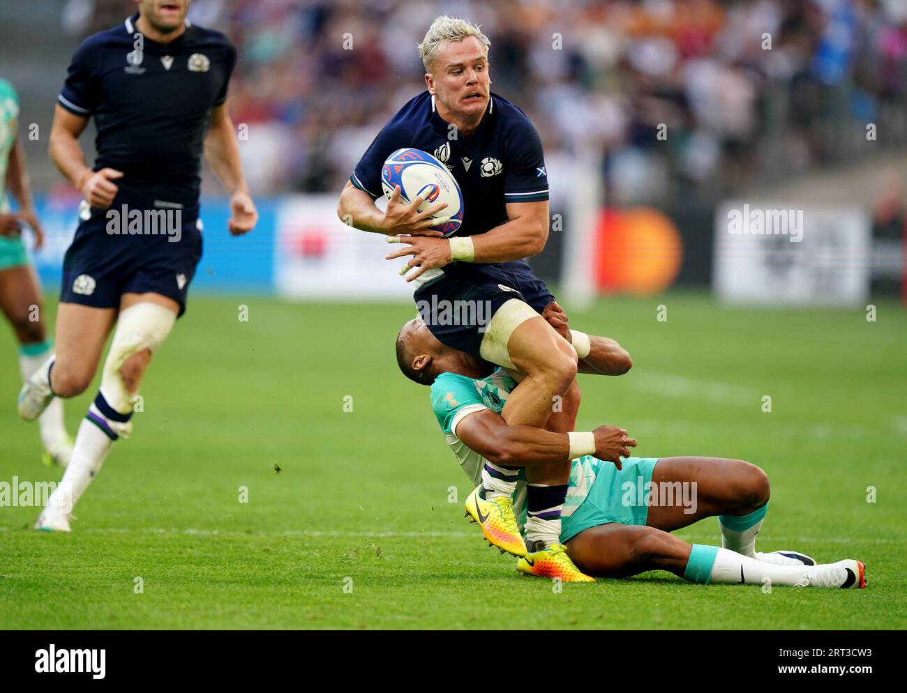 Scotland's Darcy Graham is tackled by South Africa's Manie Libbok ...