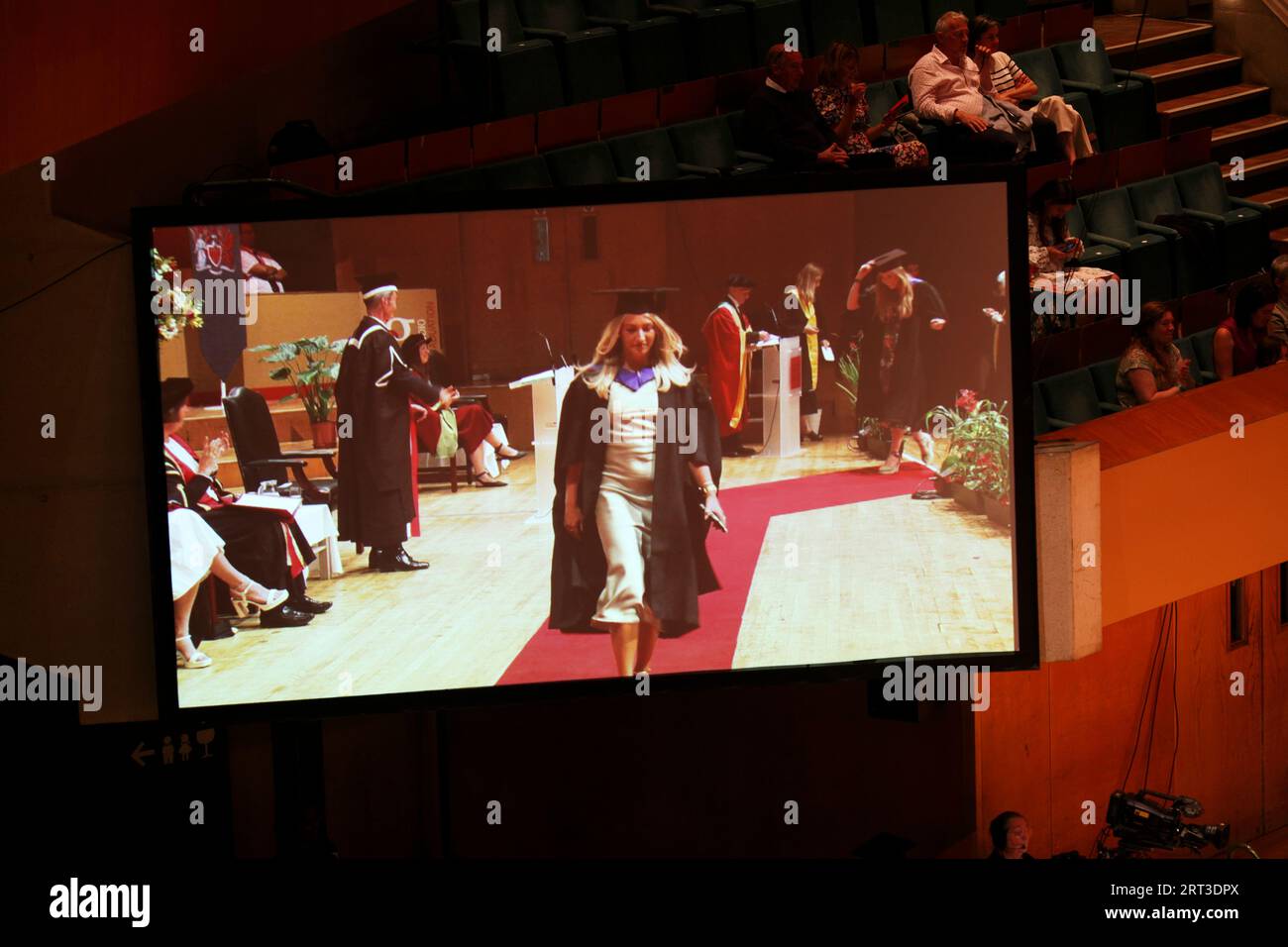 Graduation day and walking the red carpet to receive a degree, as shown ...