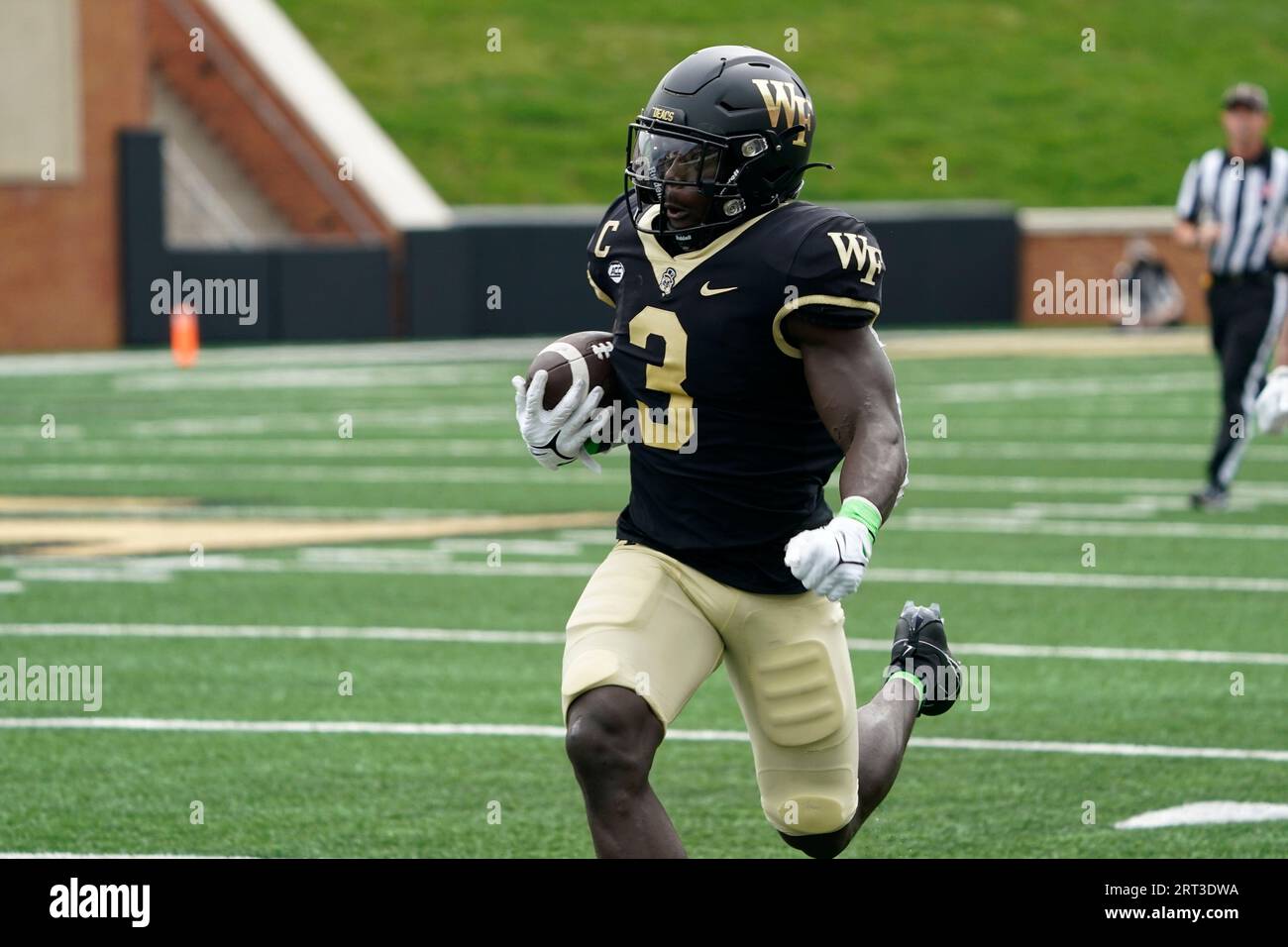 Wake Forest defensive back Malik Mustapha (3) returns an interception ...