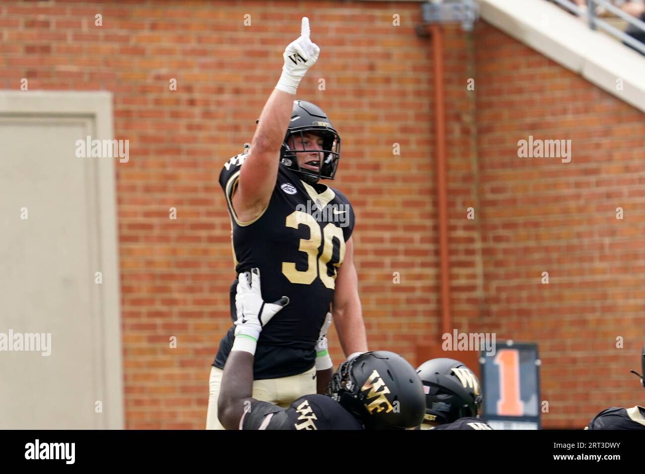 Wake Forest running back Tate Carney (30) celebrates his touchdown run ...