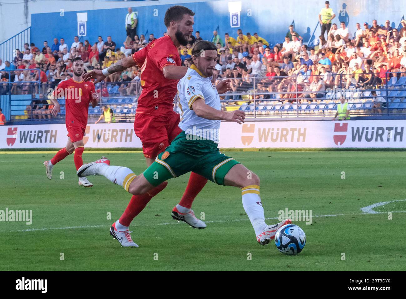 Bulgaria's Lukas Petkov, right, is challenged by Montenegro's Milos ...