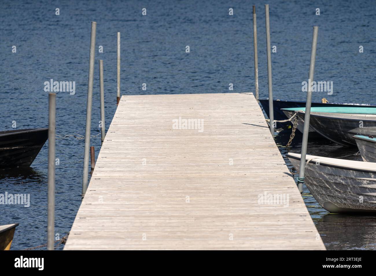 Wooden dech of a narrow floating pier Stock Photo - Alamy