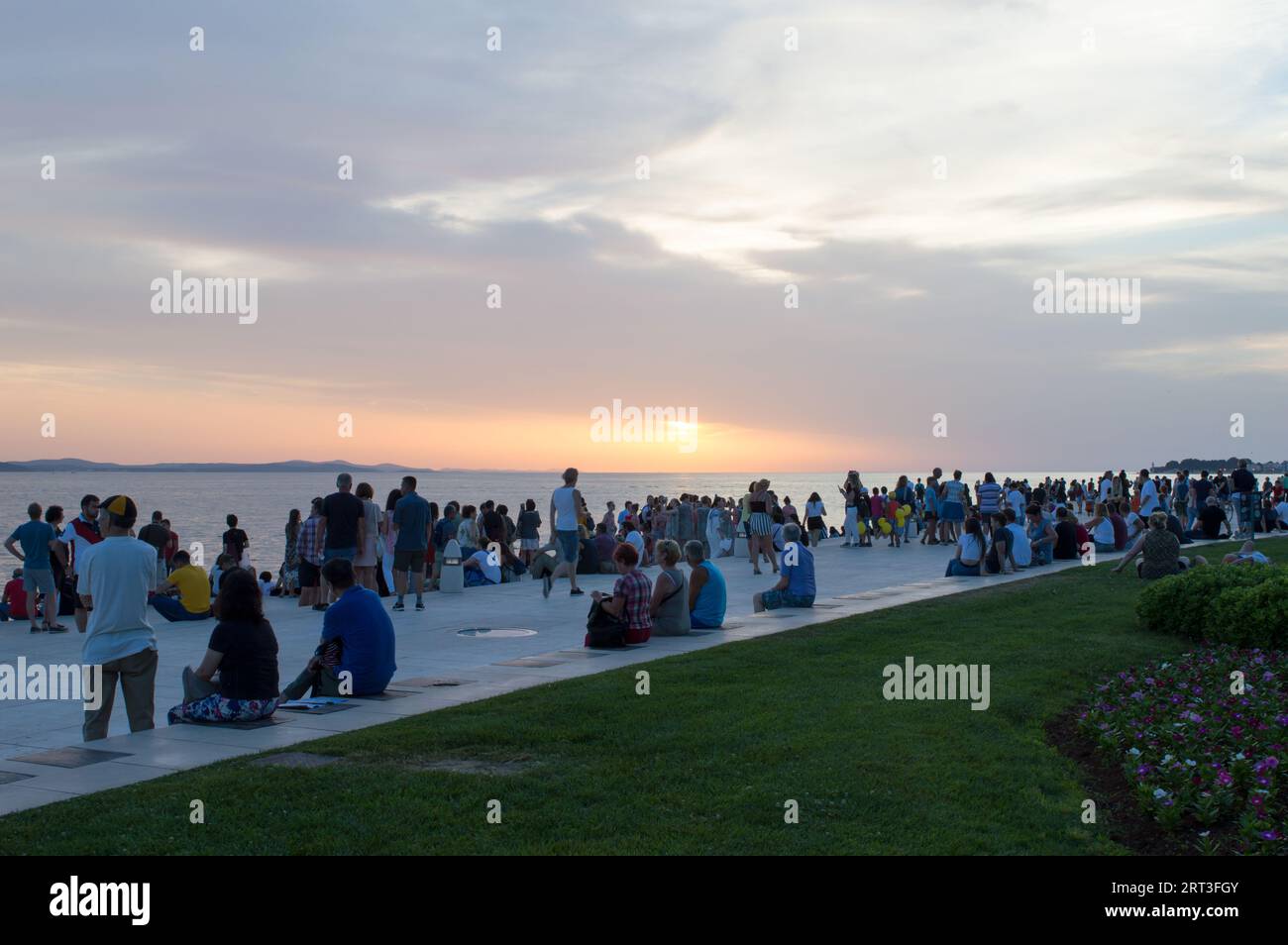 Zadar, Croatia - 15 June 2019: Tourists enyoing amazing sunset on the ...