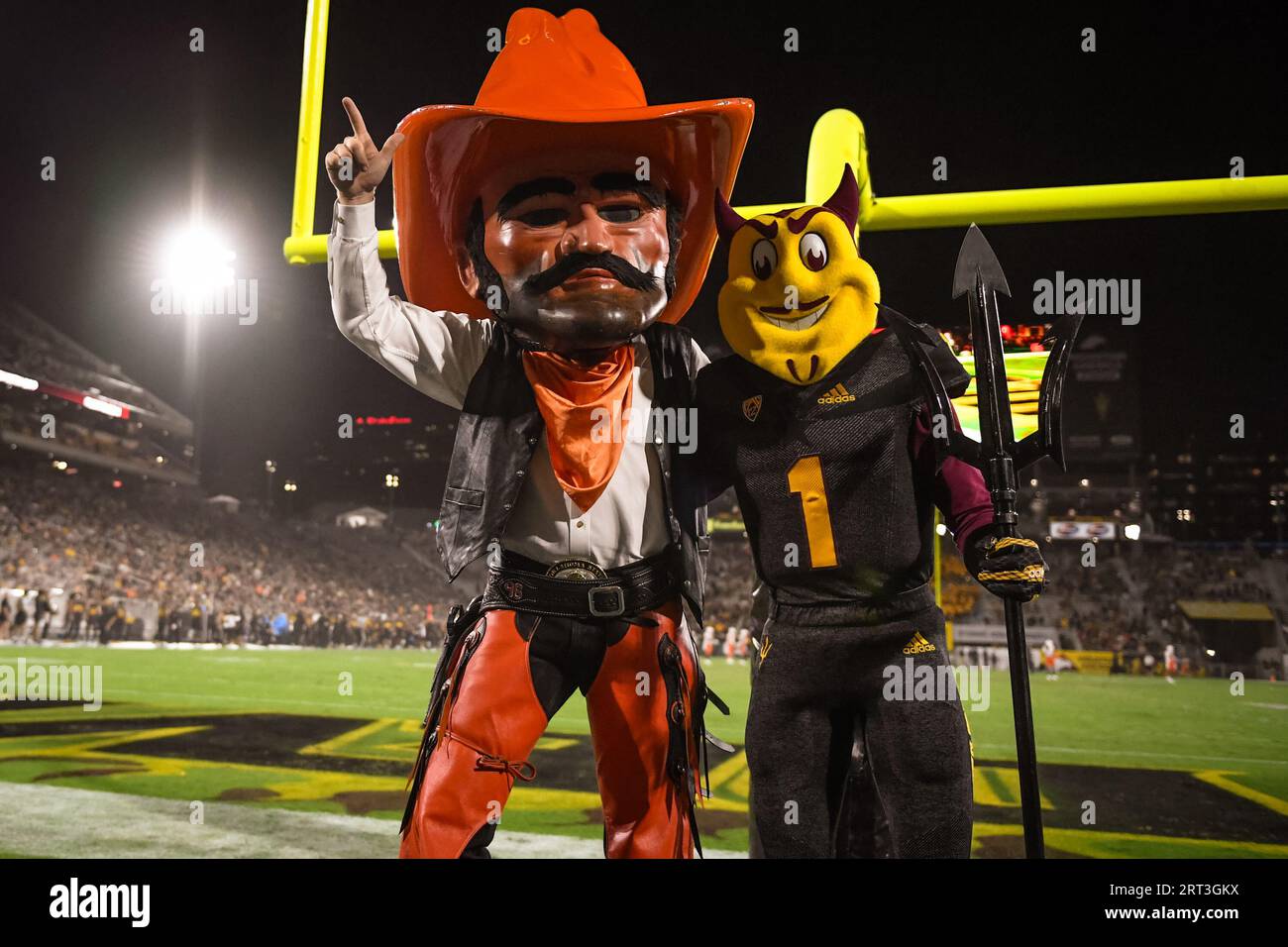 Oklahoma State mascot “Pistol Pete” and Arizona State mascot “Sparky ...