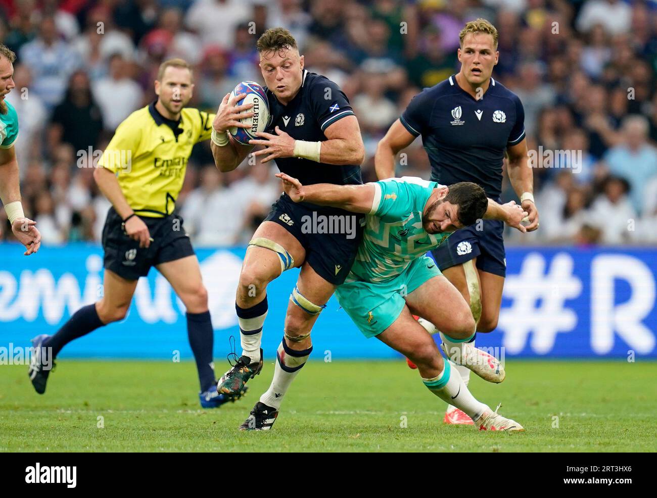 Scotland's Jack Dempsey is tackled by South Africa's Marco van Staden ...