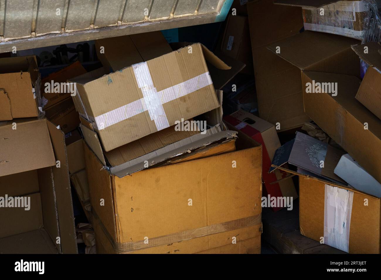 A pile of cardboard waste piled up in a landfill. Close-up Stock Photo ...