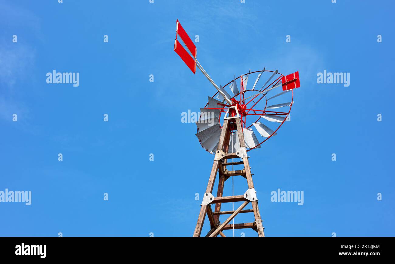 An old windpump against the blue sky Stock Photo - Alamy