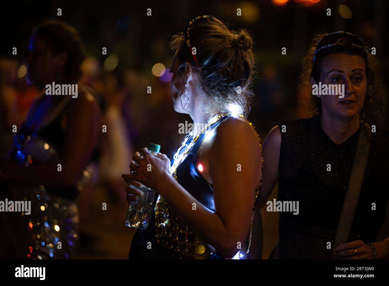 Night crowd lighting up a music festival. Mucky Weekender Festival ...