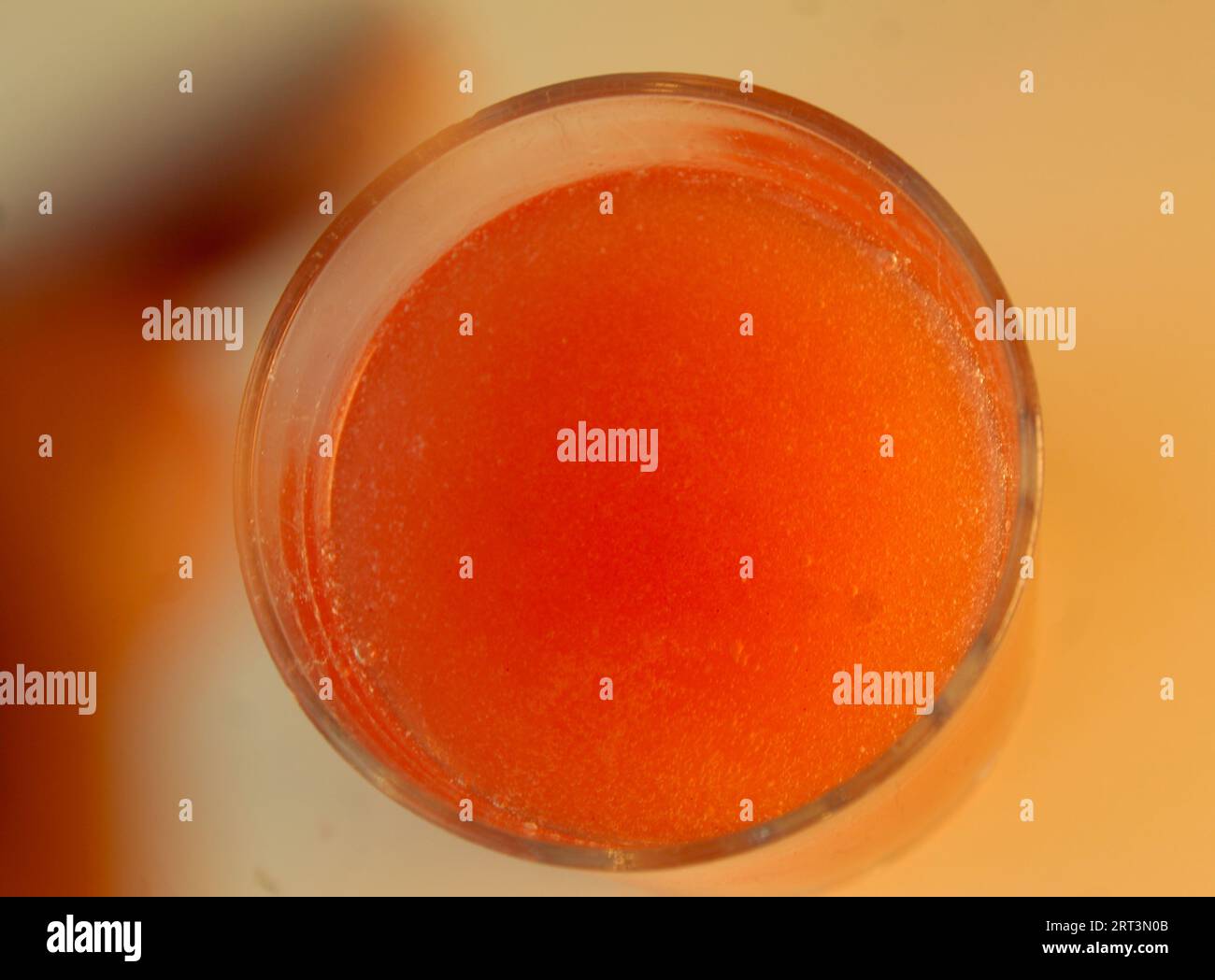 A photo of someone dropping an electrolyte tablet into a glass of water ...