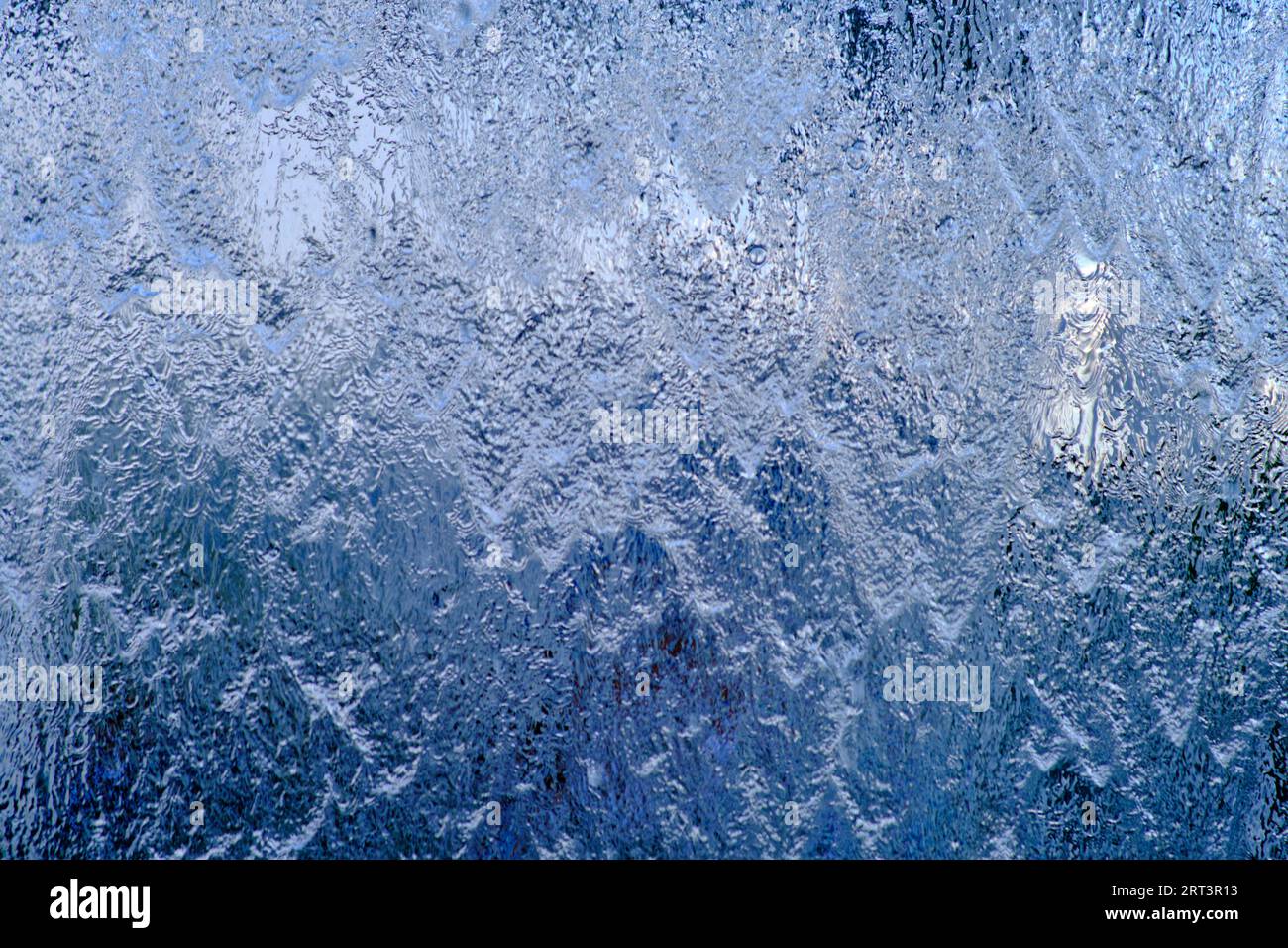 Water natural pattern on window glass. Water jets on a glass waterfall ...