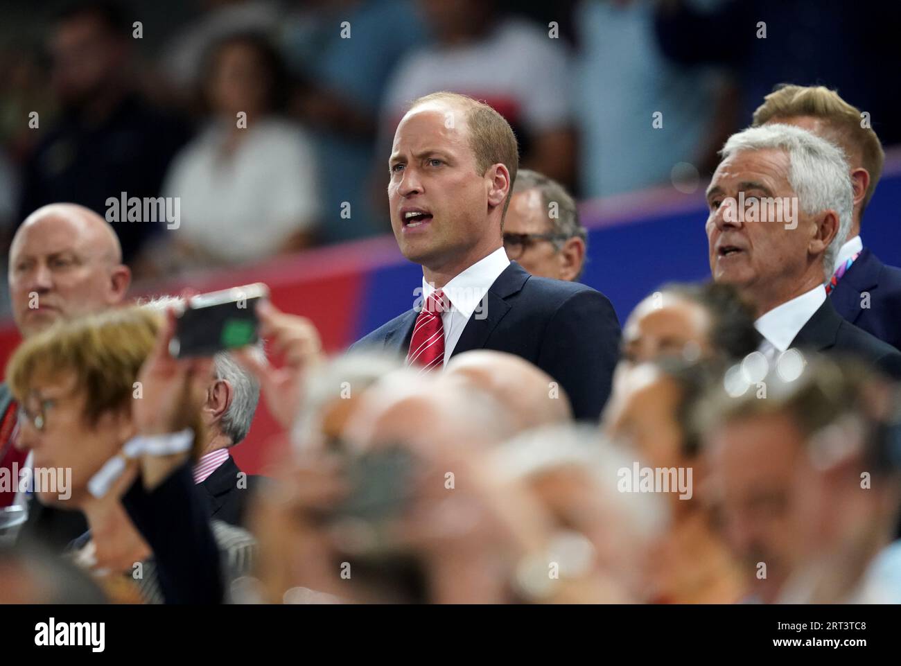 The Prince of Wales singing the Welsh national anthem in the stands ...