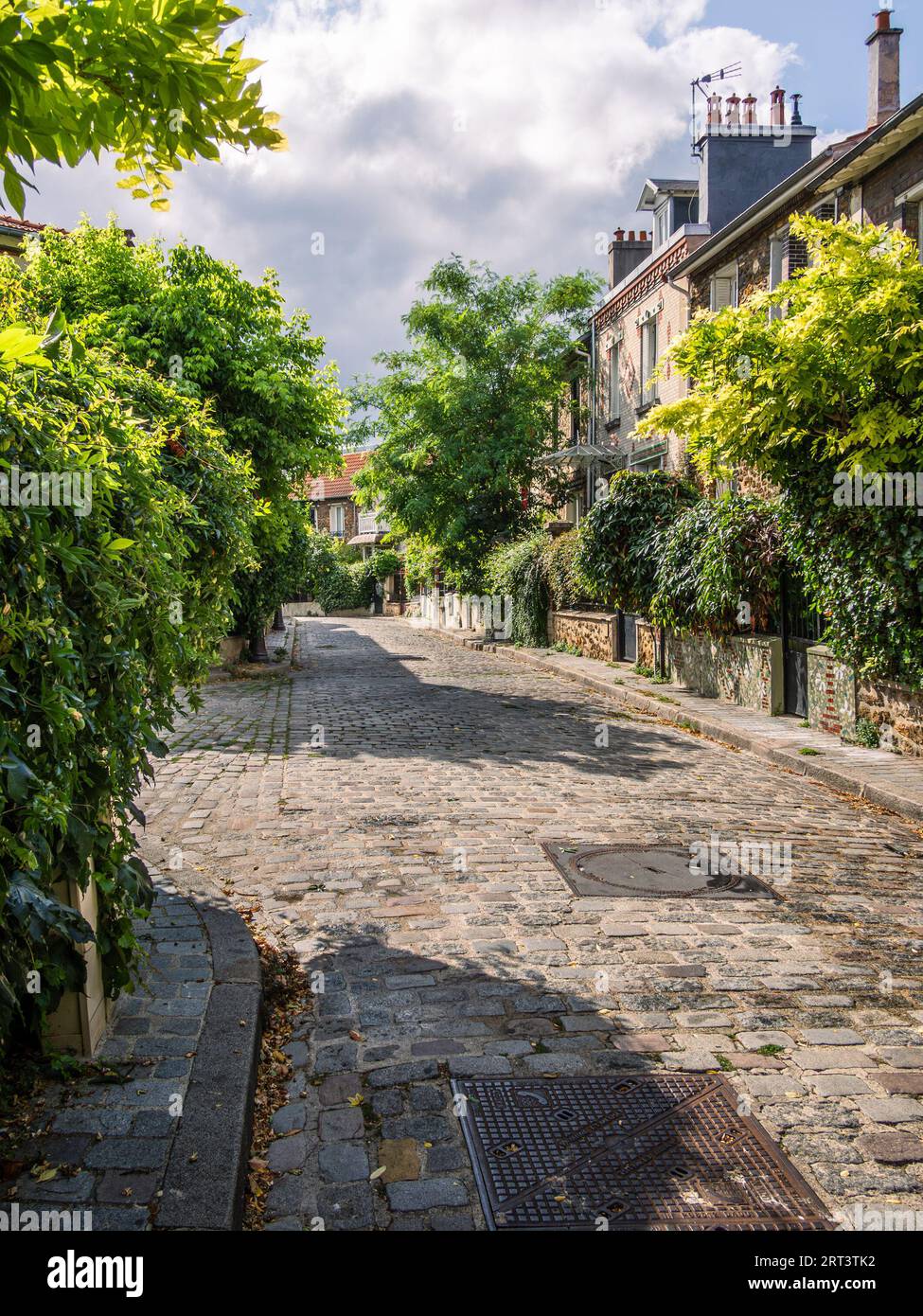 The paved streets and pretty low houses of "La Campagne ä Paris" ("the ...
