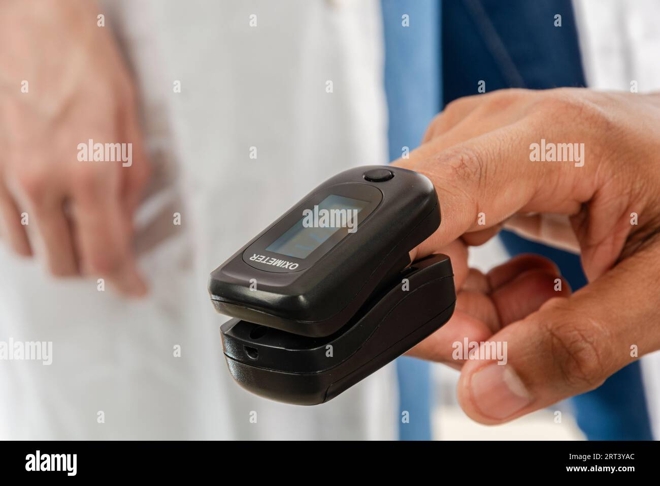 Finger of an Asian Adult from India using a pulse oximeter in the ...