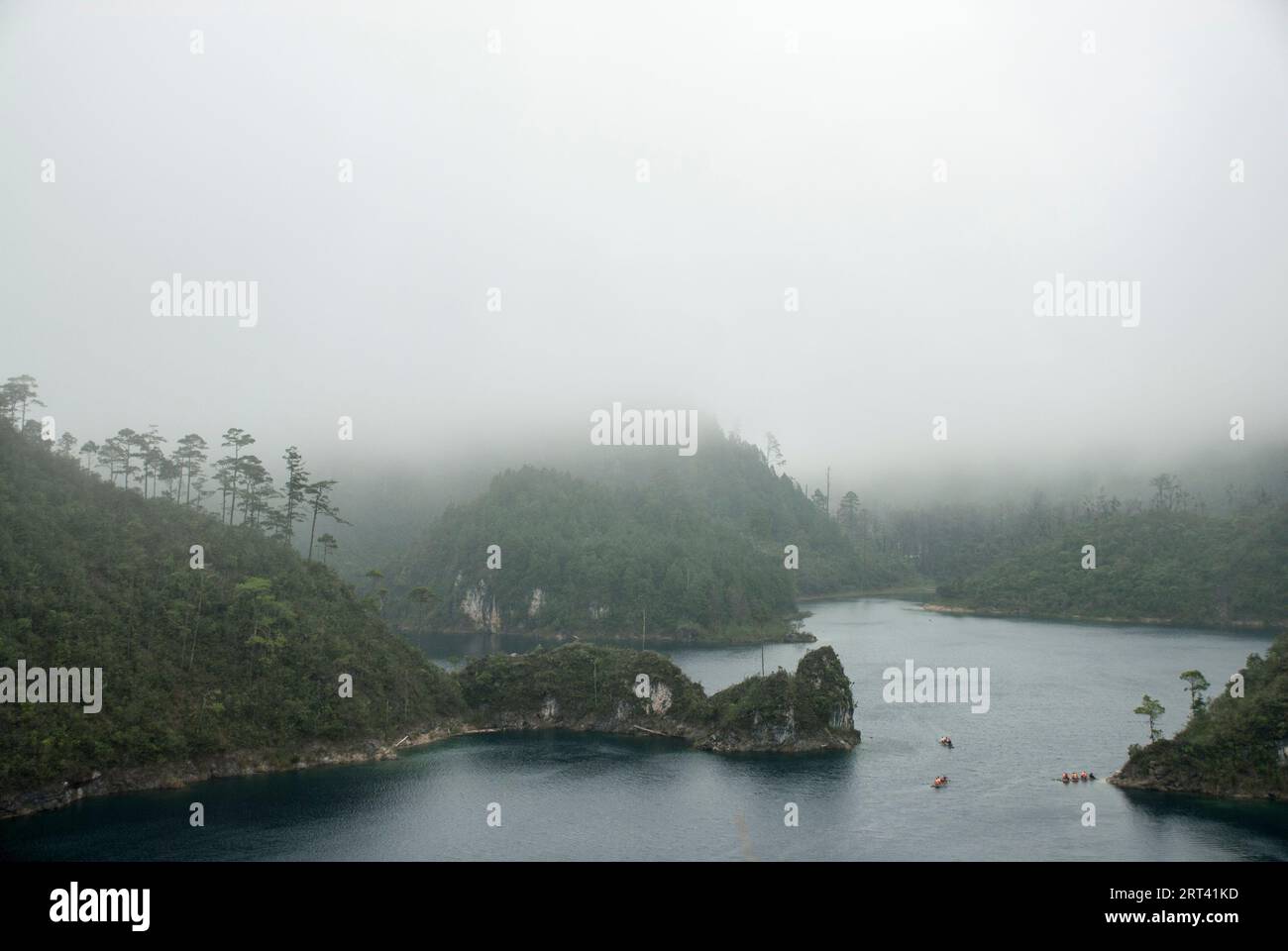 Landscape of a lake, a forest and fog. Montebello lake, Chiapas, Mexico ...