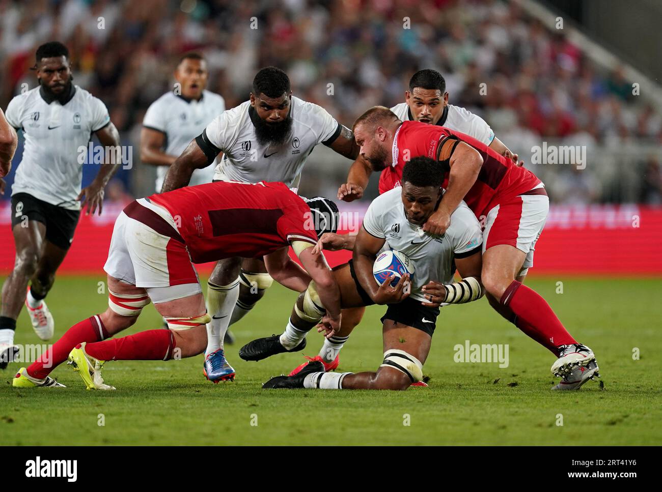 Fiji's Viliame Mata is tackled by Wales' Adam Beard (left) and Wales ...