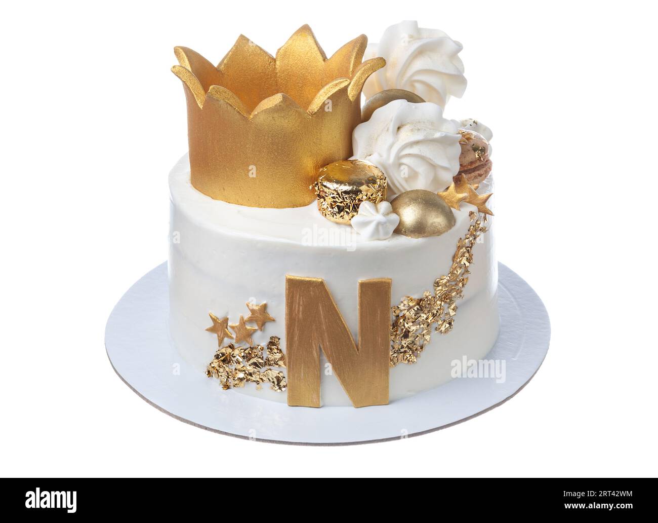 Festive white cake with the letter n in gold with marshmallows and ...