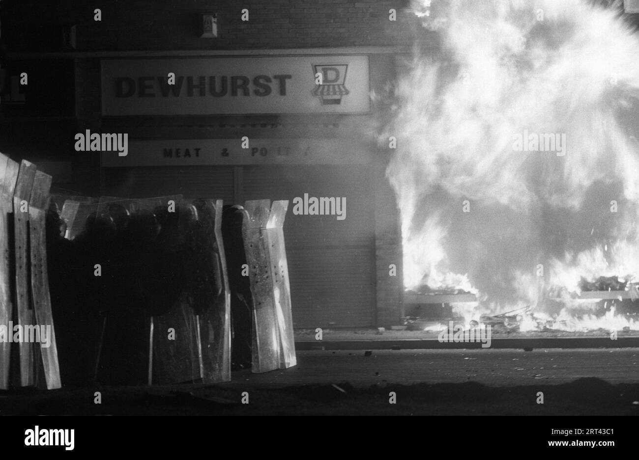 Toxteth Riots 1980s UK. Buildings are set on fire, police with shields ...