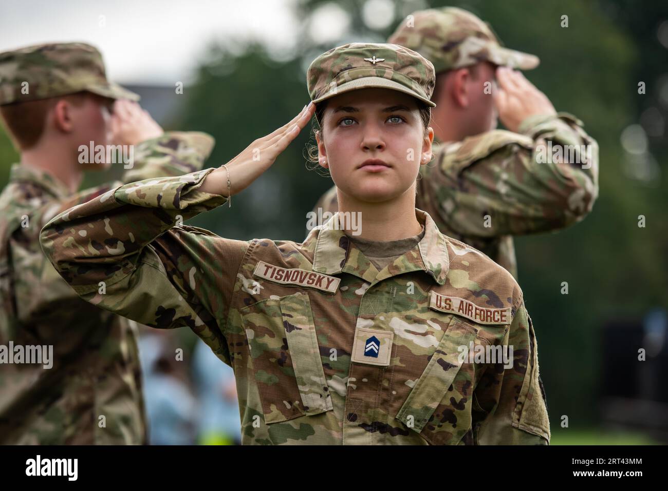 Soldiers saluting at event remembering military service members and ...