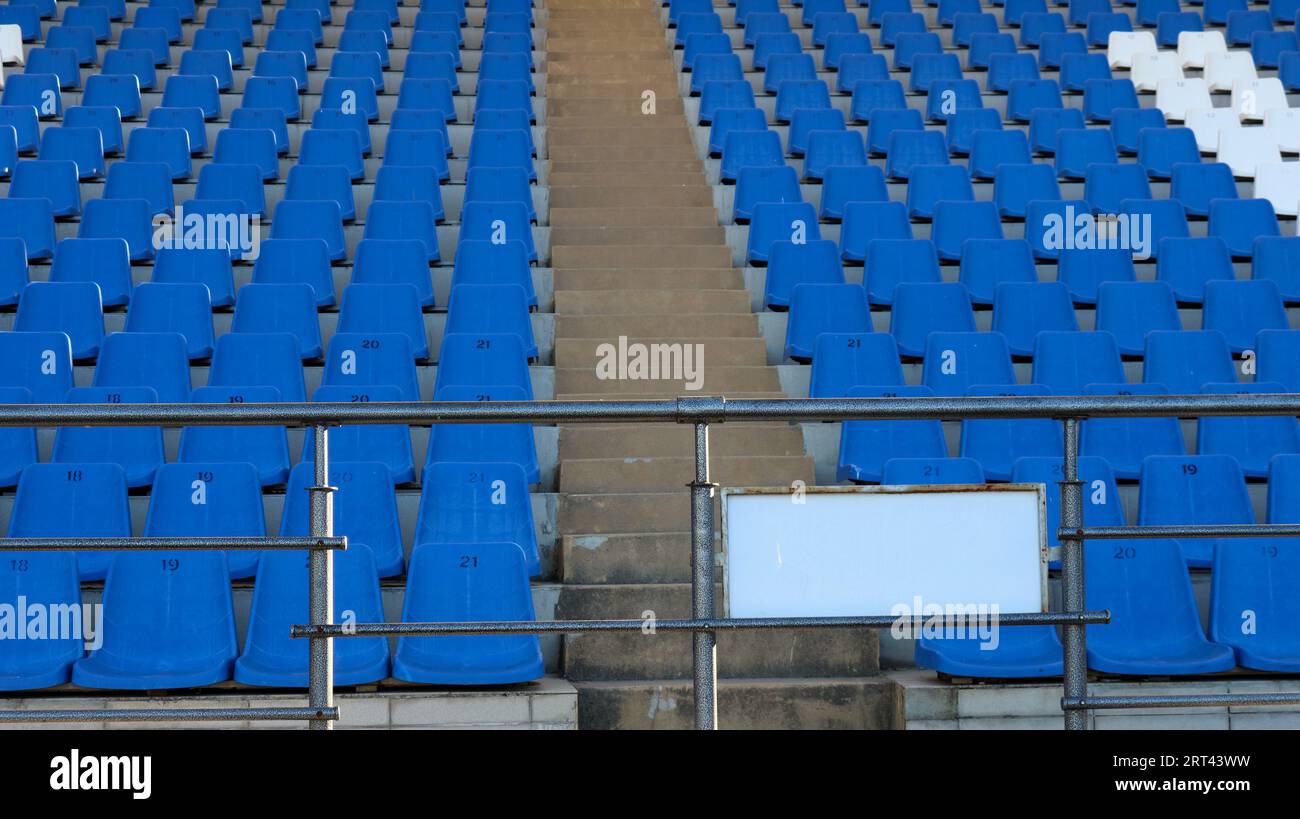 blue texture background of plastic seats in a sector of a sports ...