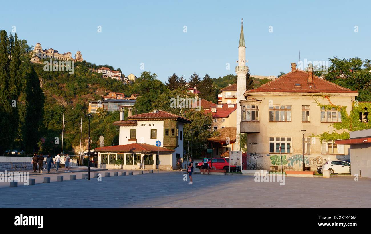 Square with Inat Kuca restaurant, minaret and mansion style property on ...