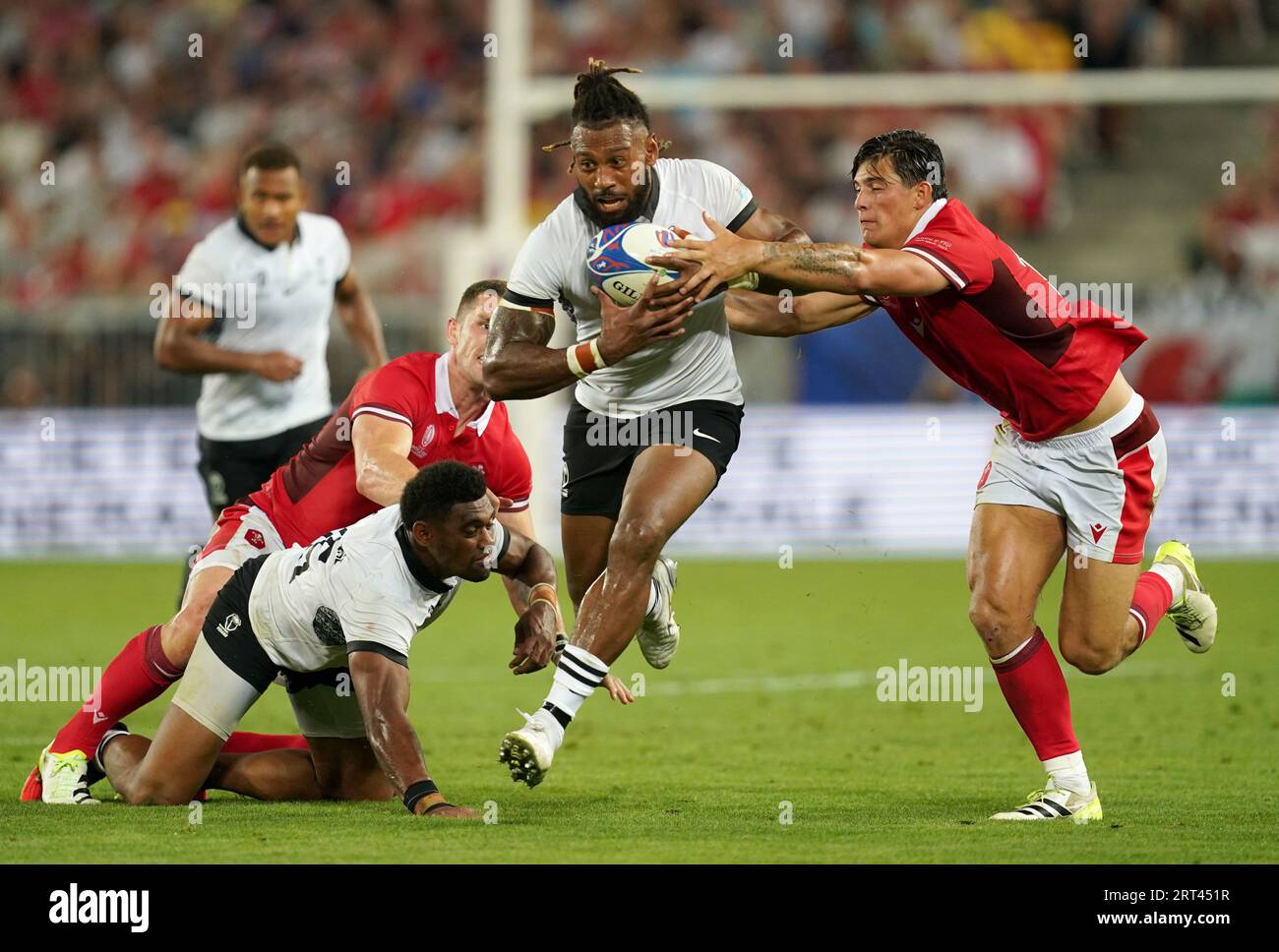 Fiji's Waisea Nayacalevu is tackled by Wales' Louis Rees-Zammit (right ...