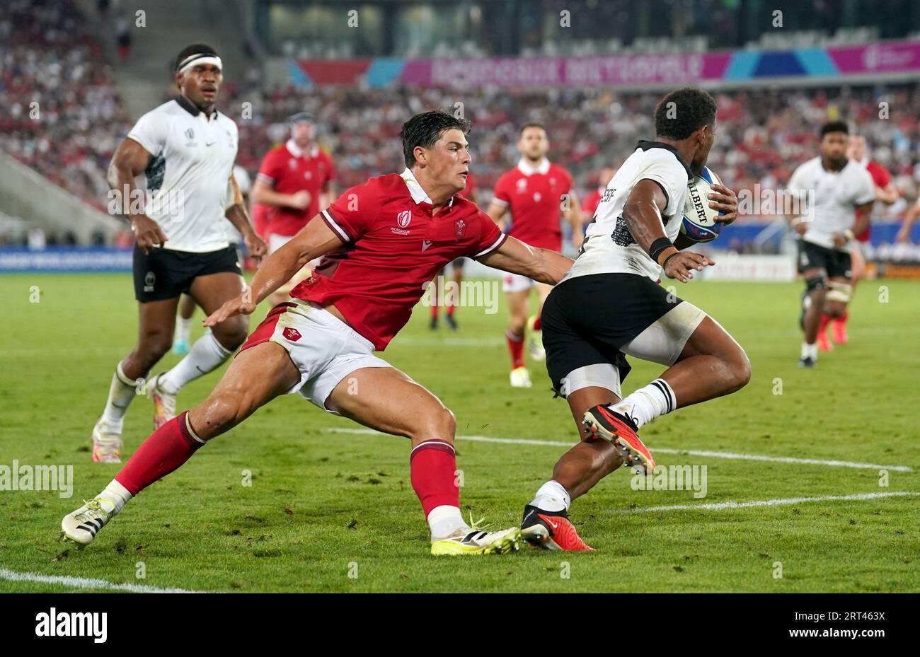Wales' Louis Rees-Zammit (left) and Fiji's Ilaisa Droasese during the ...