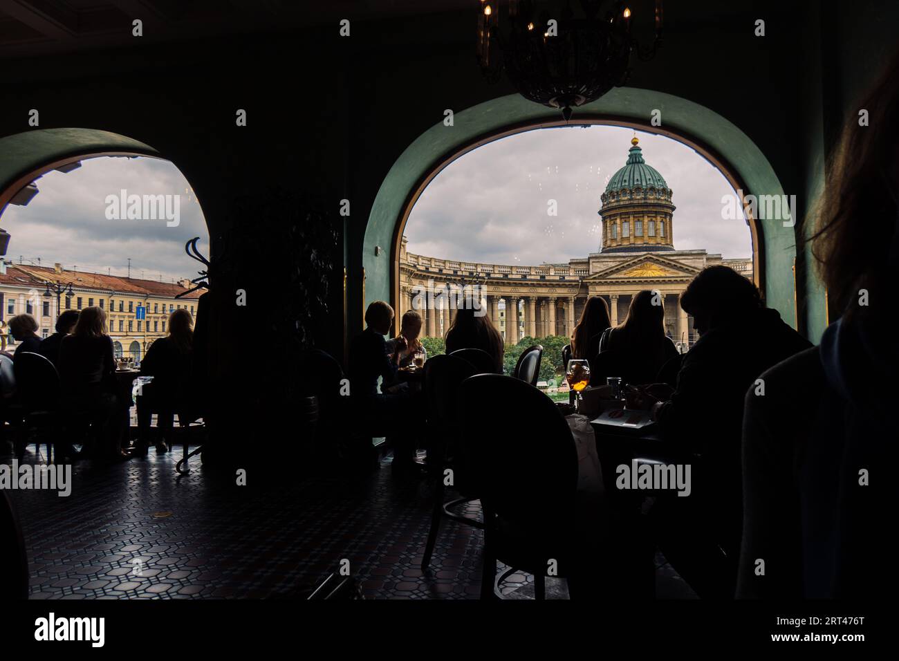View of Kazan Cathedral from Singer Cafe through window. Silhouettes of ...