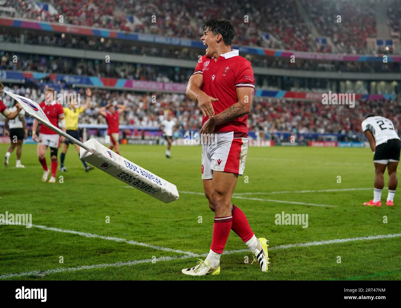 Wales' Louis Rees-Zammit celebrates at the final whistle during the ...