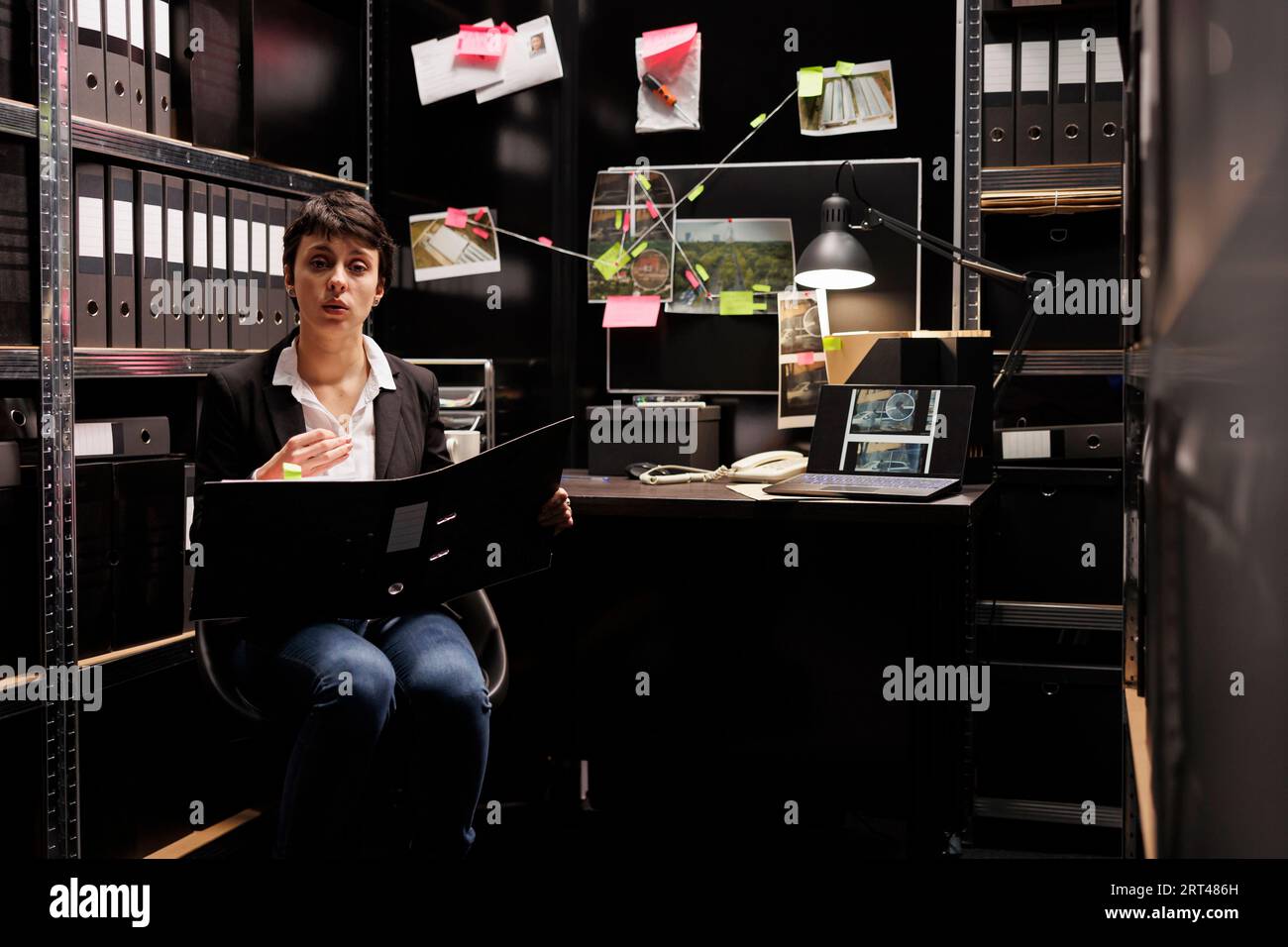 Police officer discussing with remote private detective during ...