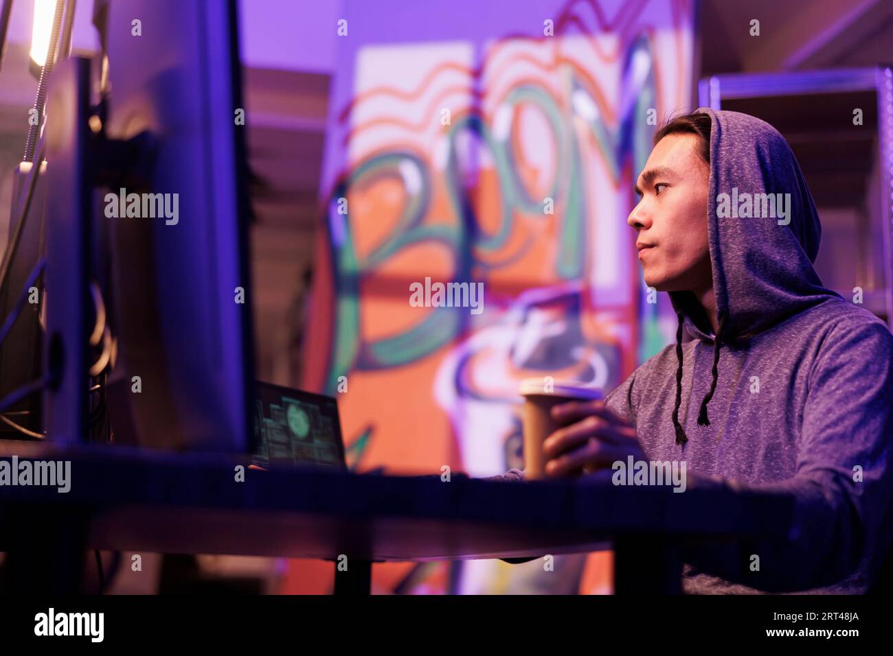 Hacker In Hood Cracking Database Password And Drinking Takeaway Coffee