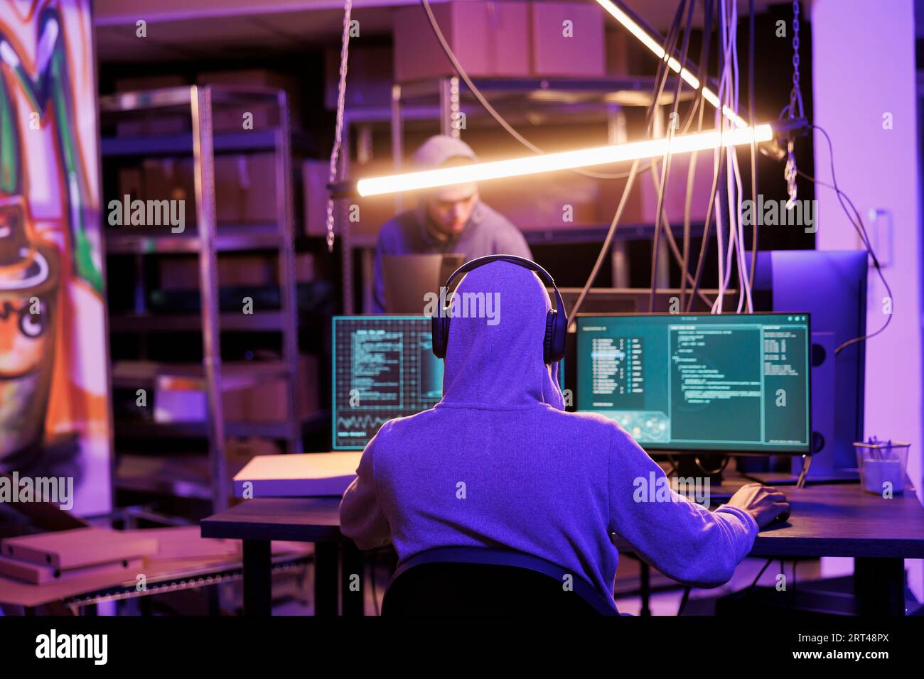 Hacker In Headphones Listening To Music While Cracking Password On Computer Internet Criminal