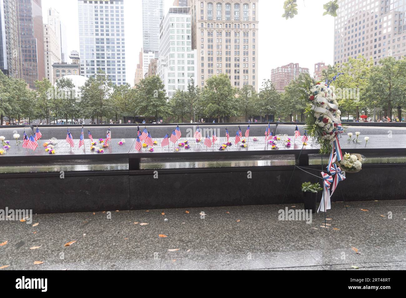 Public, Flags and flowers are seen at the Pool site where the WTC ...