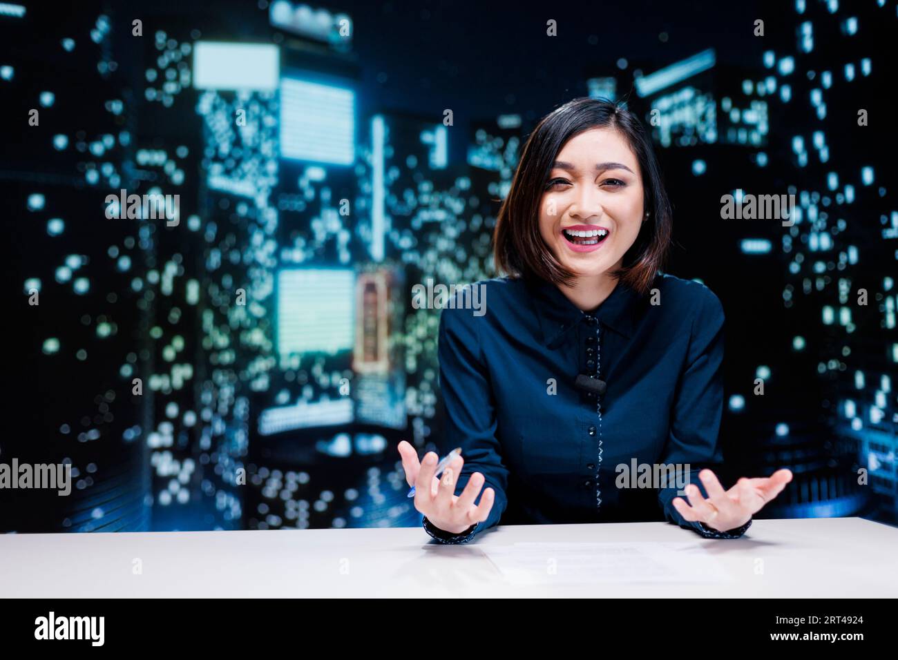 Asian newscaster on late night show discussing about daily breaking ...