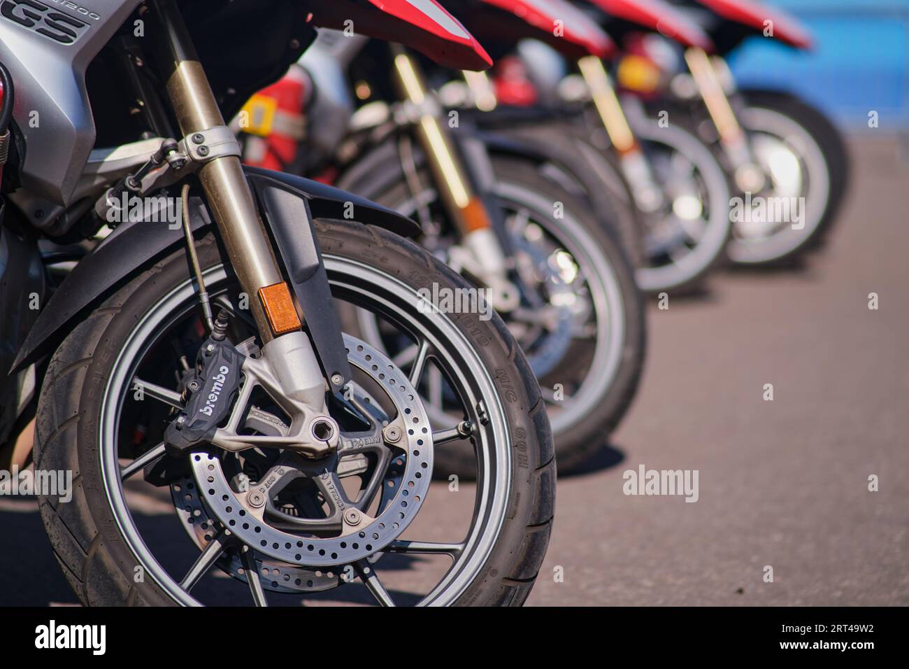 Close-up of the rear wheel of a fireman motorcycle BMW G5 on the street ...