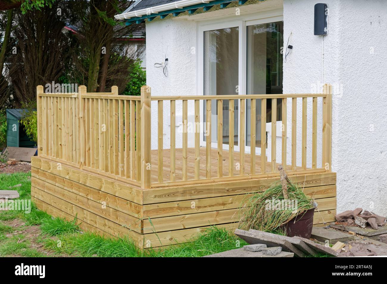 New decking built in garden at residential building refurbishment Stock ...