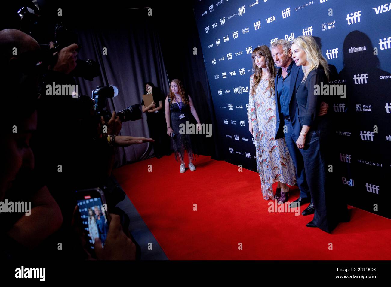 Dakota Johnson, from left to right, Sean Penn and Christy Hall attend ...