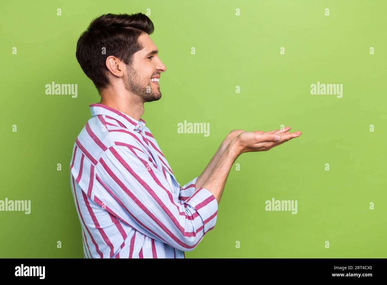 Side profile photo of funny man stubble dressed striped shirt palms ...