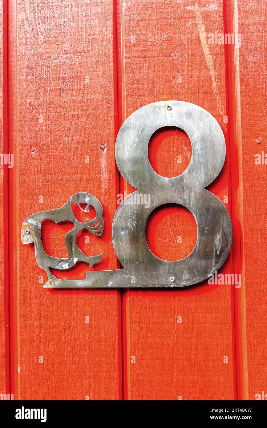 Number 8 on the wooden wall of a traditional building, Mykines Island ...