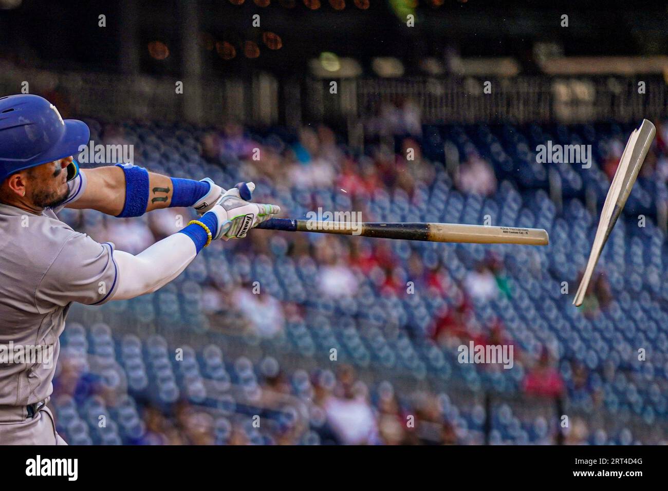 Los Angeles Dodgers' Miguel Rojas breaks his bat as he hits a single ...