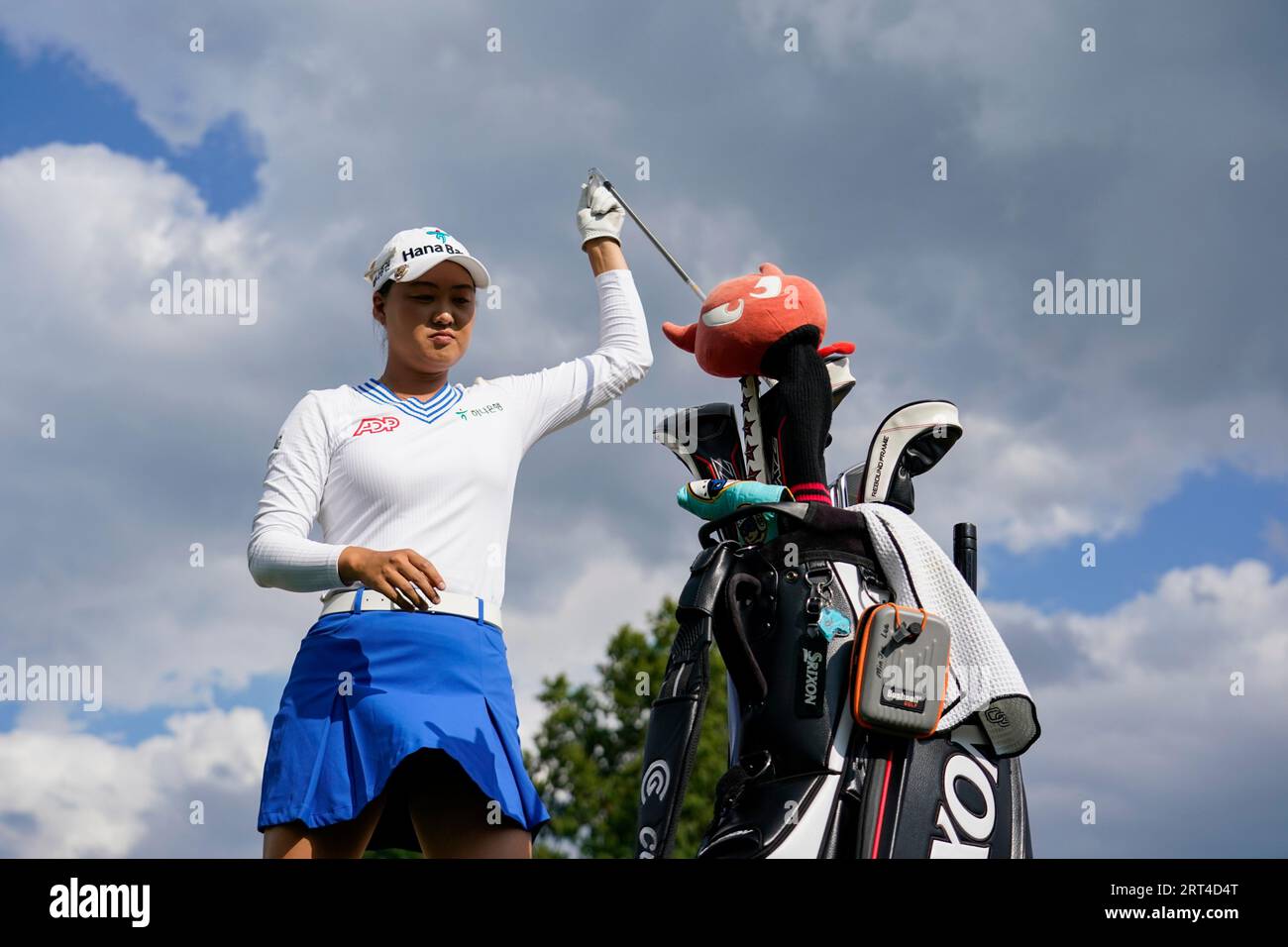 Minjee Lee takes a club out of her bag before hitting out of a sand ...