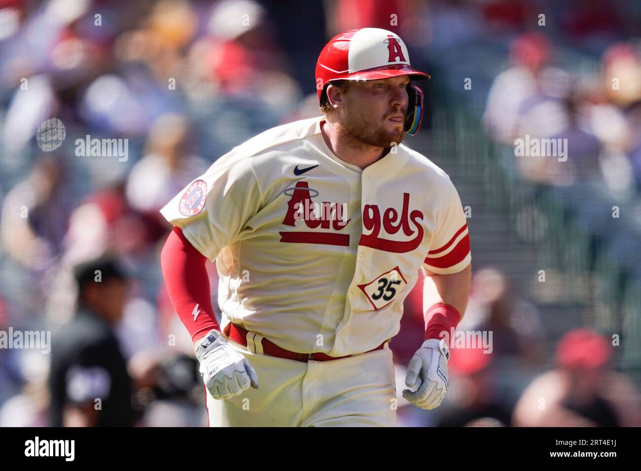 Los Angeles Angels' Chad Wallach attempts to run to first after flying ...