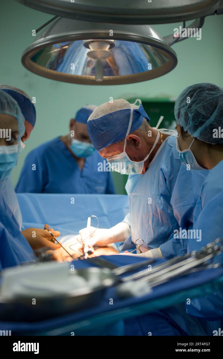 C-section surgery umbilical cord, doctor operating Stock Photo - Alamy