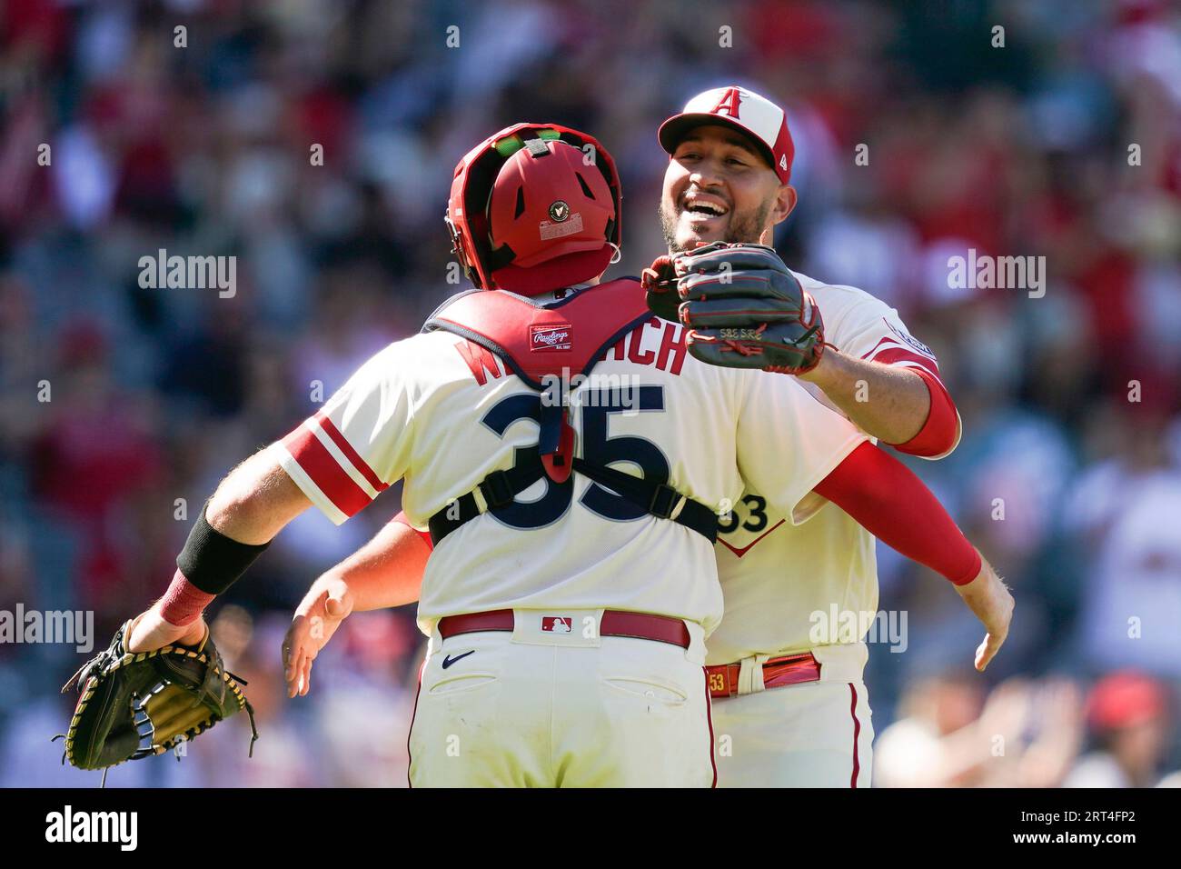 Los Angeles Angels relief pitcher Carlos Estevez hugs catcher Chad ...