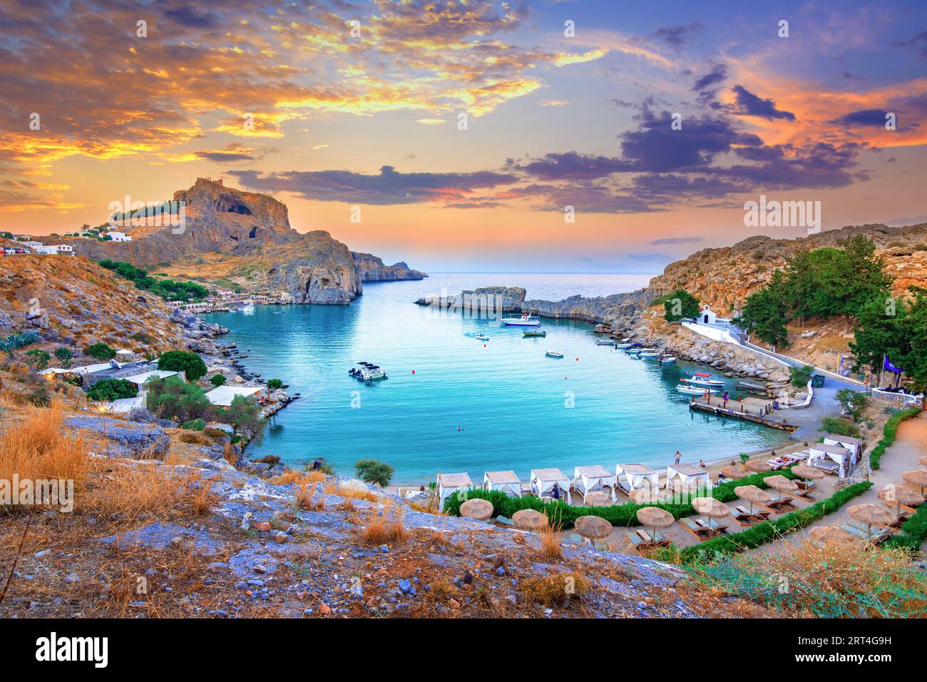 Panoramic view of St. Paul bay with acropolis of Lindos in background ...