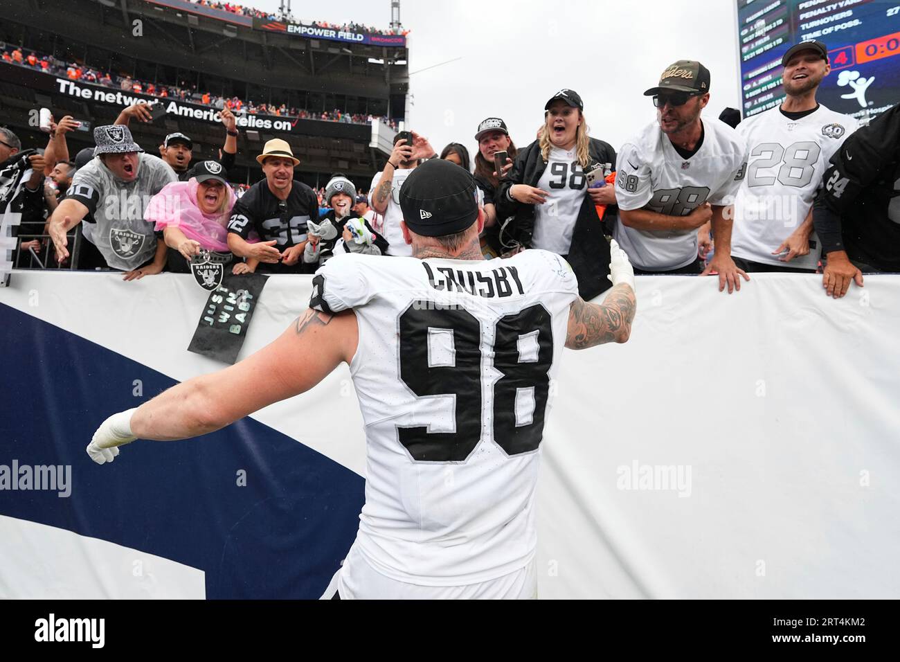 Las Vegas Raiders defensive end Maxx Crosby (98) celebrates with fans ...